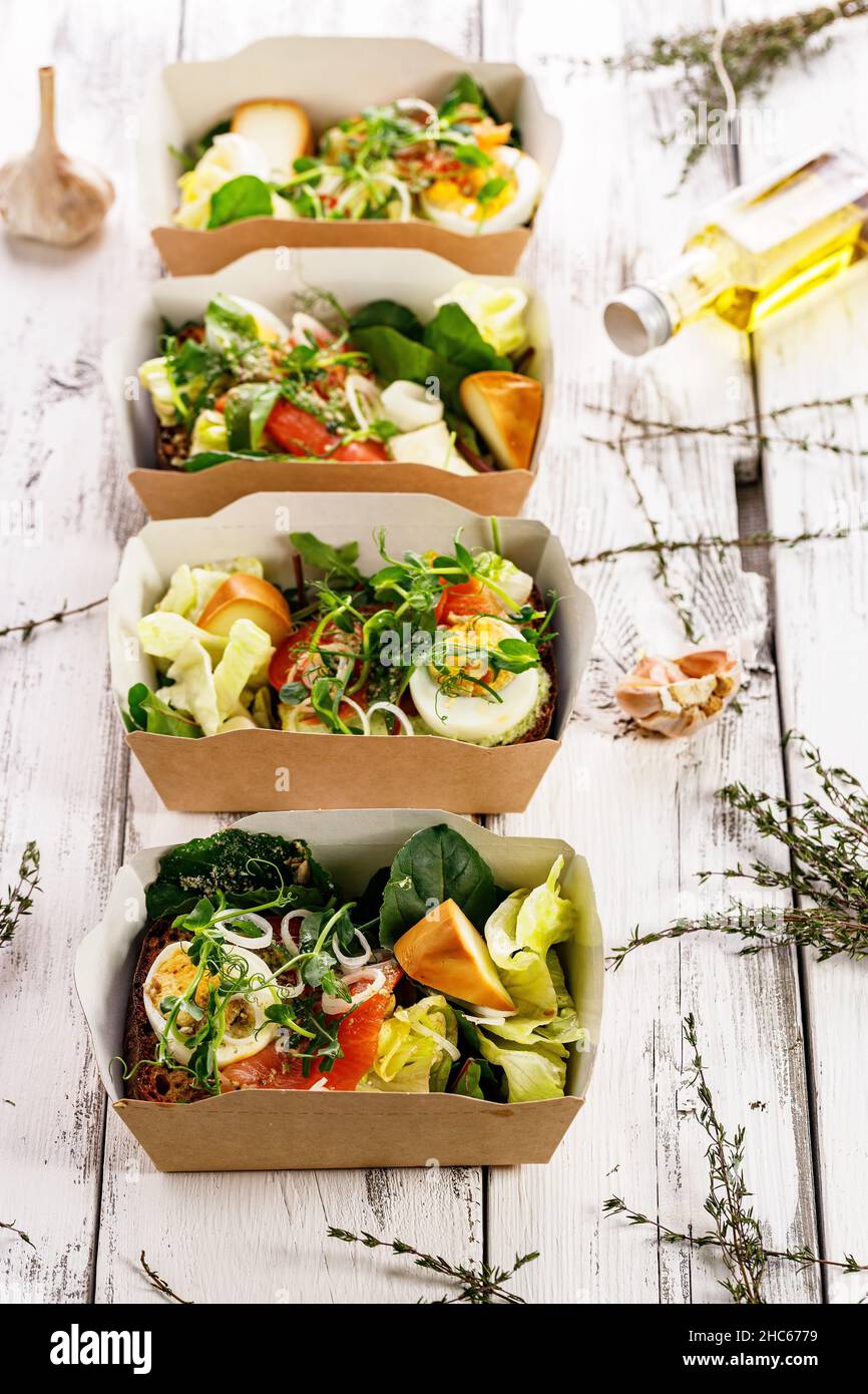 Delicious and healthy lunch with salmon fish fillet in a card box ...