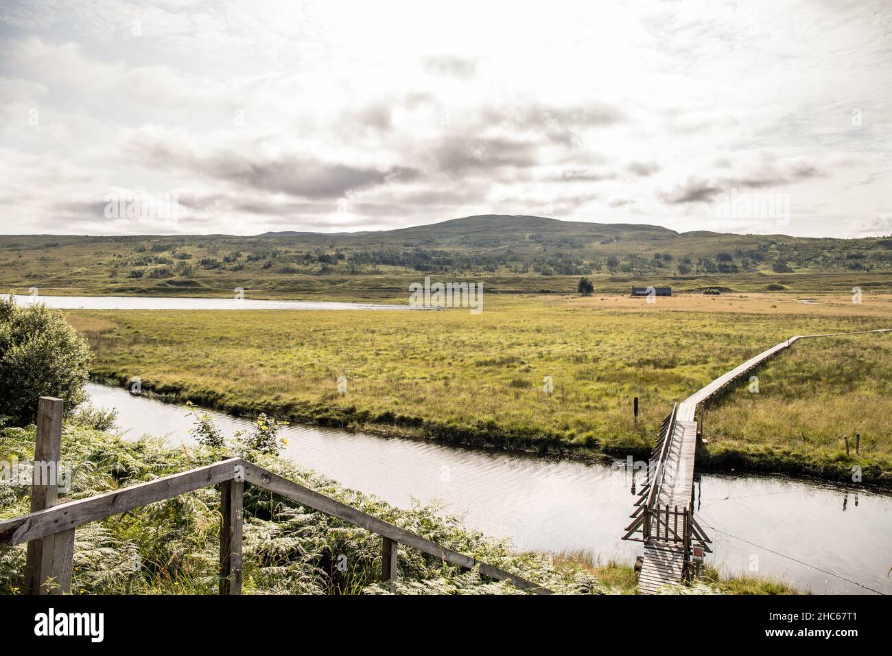 Beautiful view of a mountain in a green landscape and small water ...