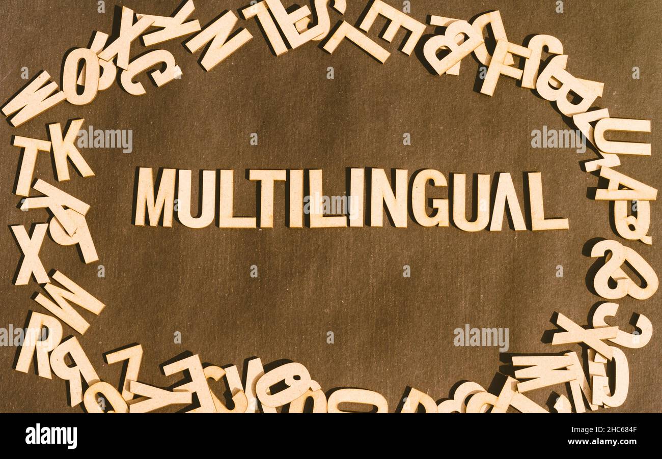 Multilingual word from wooden blocks of Alphabet letters. Table Top ...