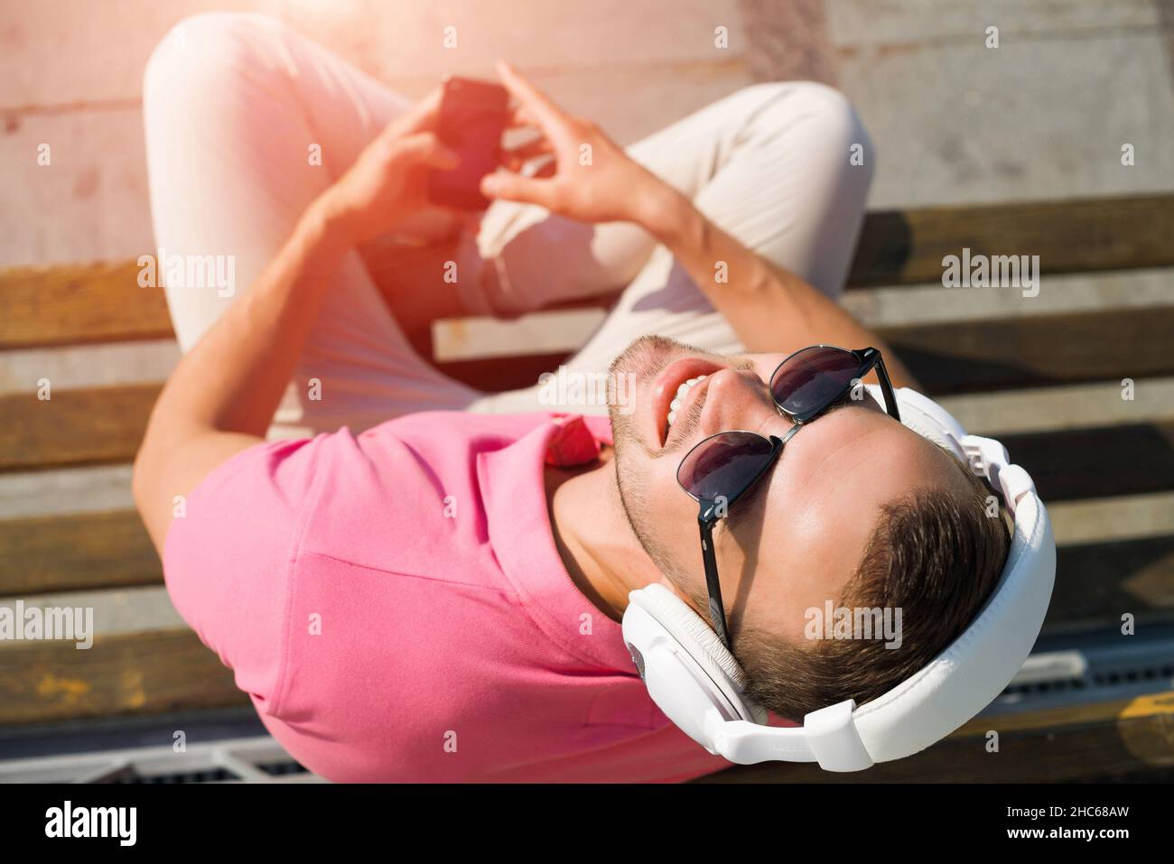Handsome guy on bench Stock Photo - Alamy