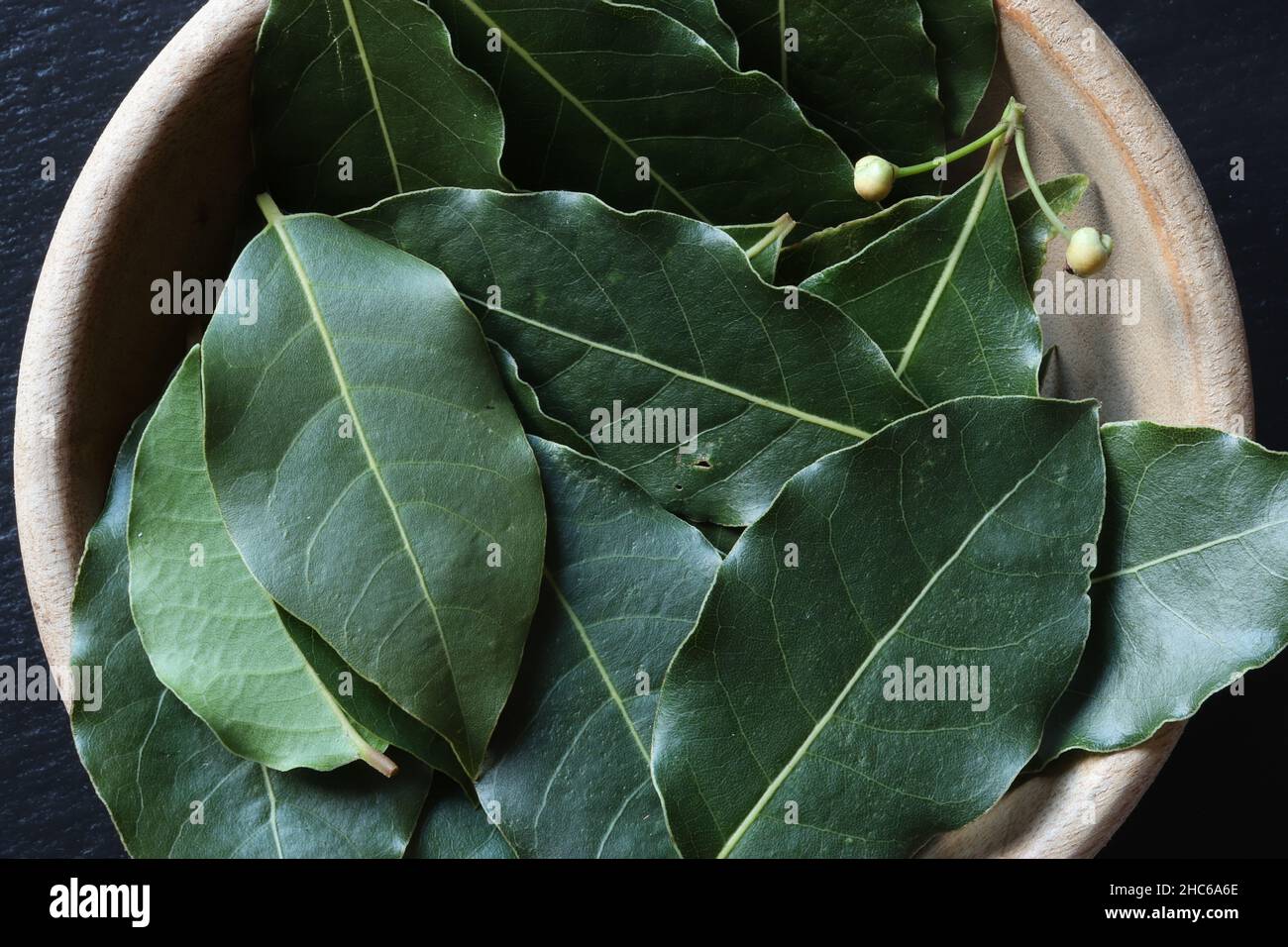 Photography of laurel leave in a wooden bowl for food background Stock ...