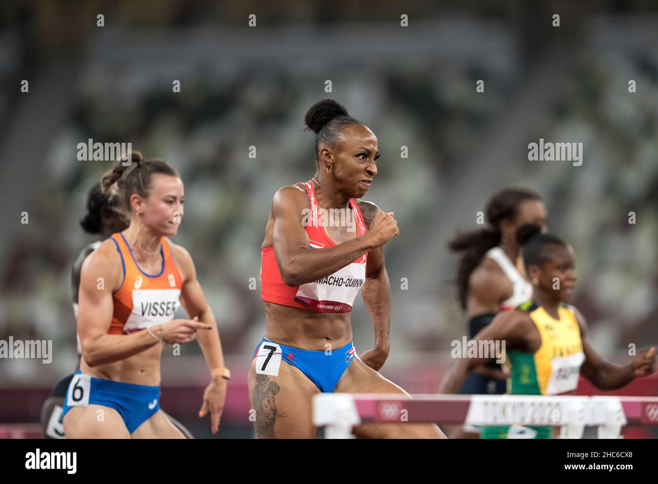 Jasmine Camacho-Quinn running and winning in the final of the 100 meter ...