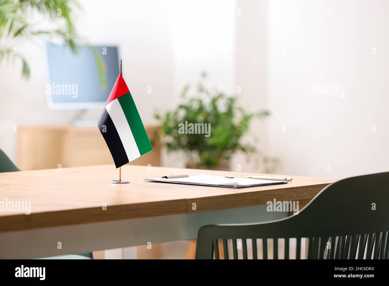 UAE flag, clipboard and pen on table in office Stock Photo - Alamy