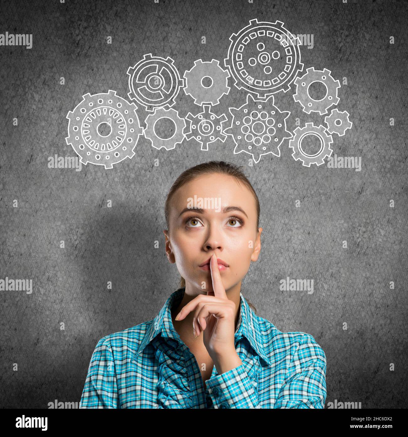 Girl showing hush gesture Stock Photo - Alamy