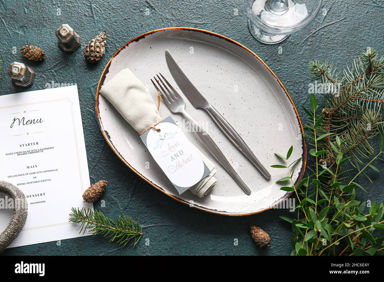 Beautiful table setting with wedding invitation and menu on black ...