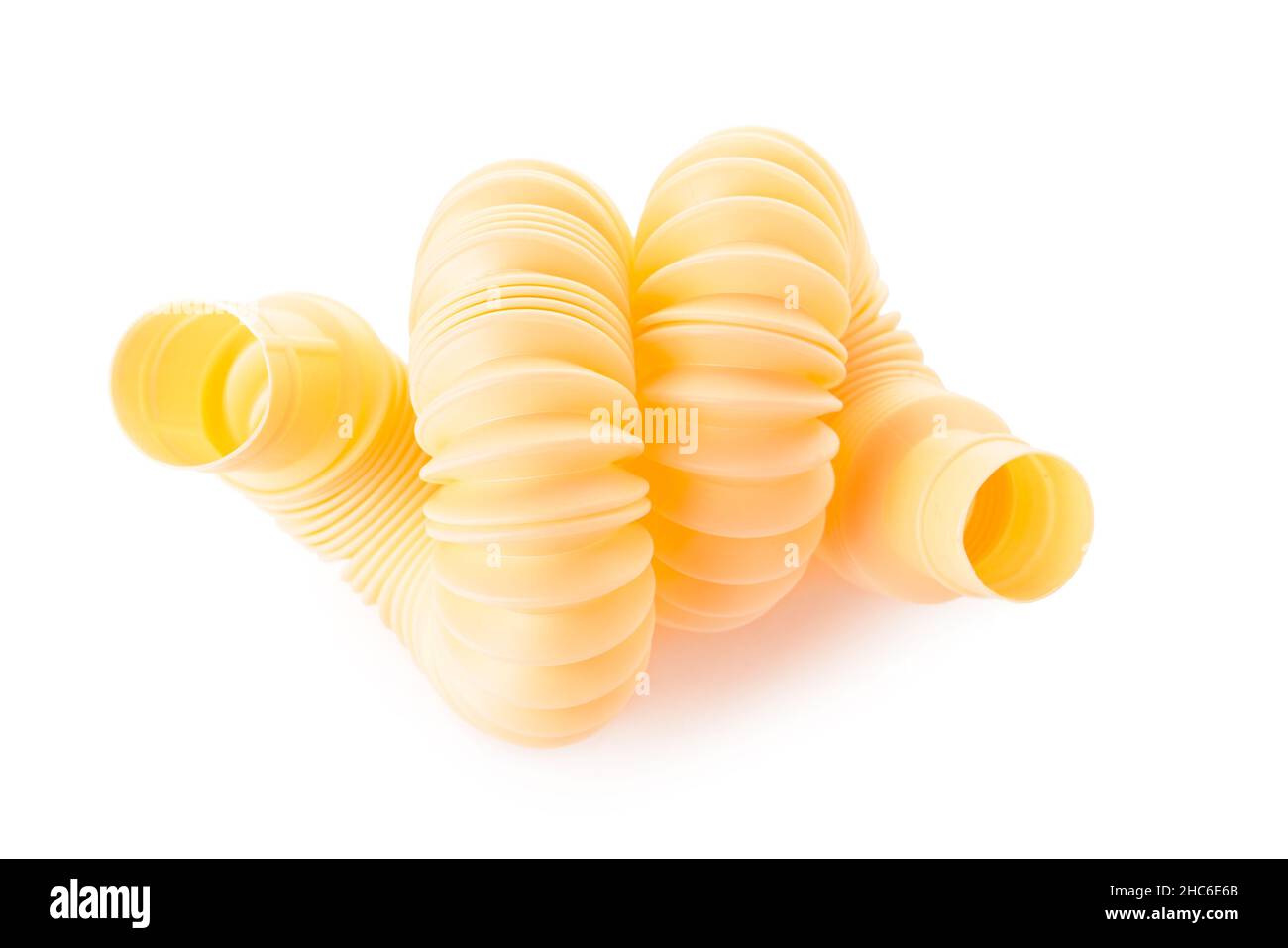Orange Pop Tube on white background Stock Photo - Alamy