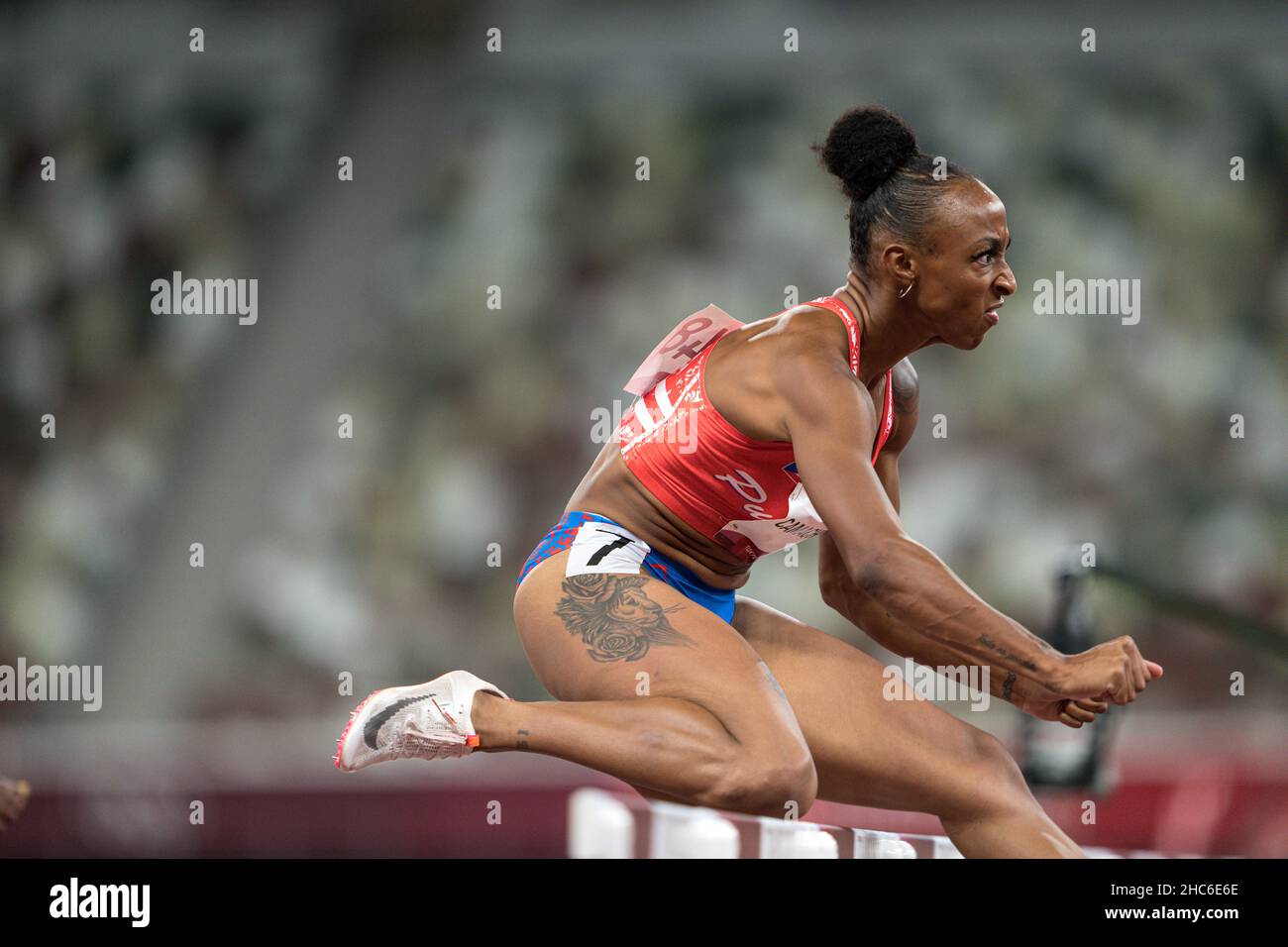 Jasmine Camacho-Quinn running and winning in the final of the 100 meter ...