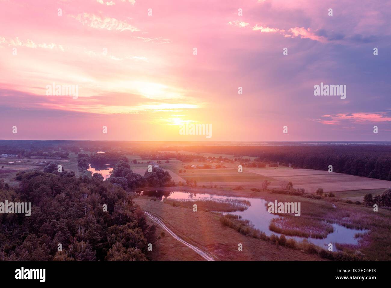 Beautiful sunset in the countryside in spring with the blazing sky ...