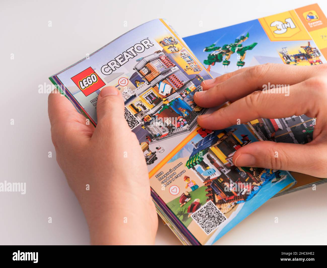 Tambov, Russian Federation - December 21, 2021 Woman browsing Lego ...
