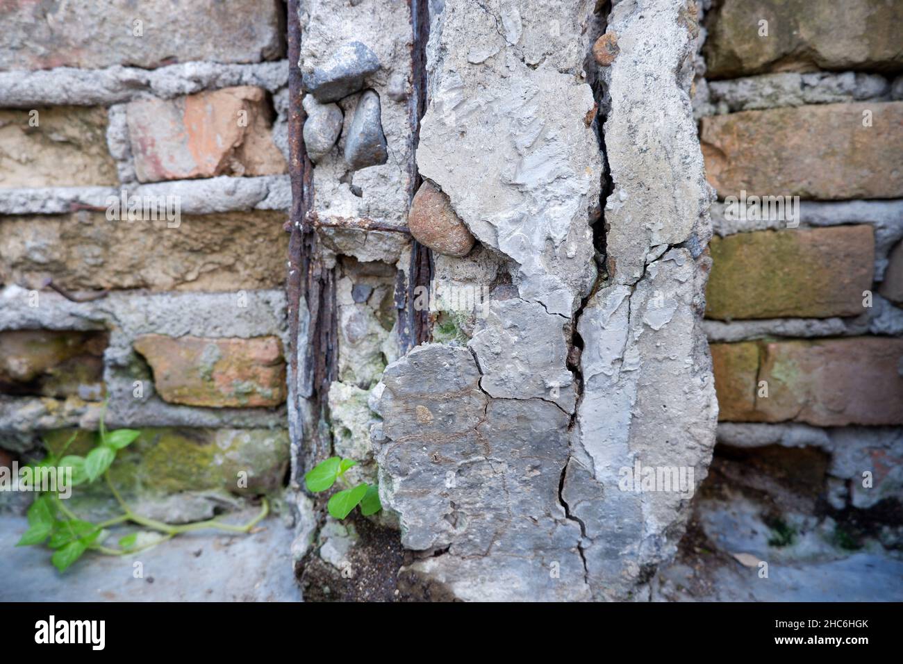 Damaged concrete pillar with rusty iron fittings Stock Photo - Alamy