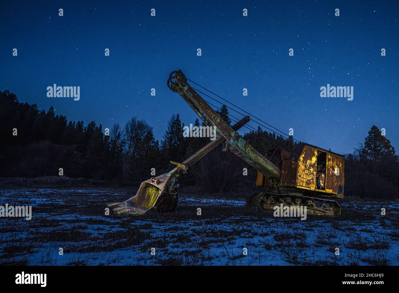 Old Excavator in a Field at Night Stock Photo - Alamy