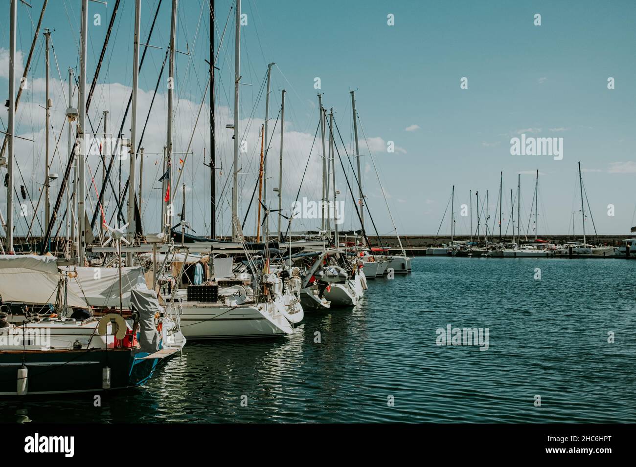 View to bay with sea water and moored boats, yachts. Amazing azure ...