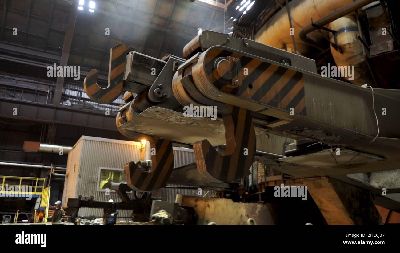 Close up for metallurgical chute at the steel factory, heavy industry ...