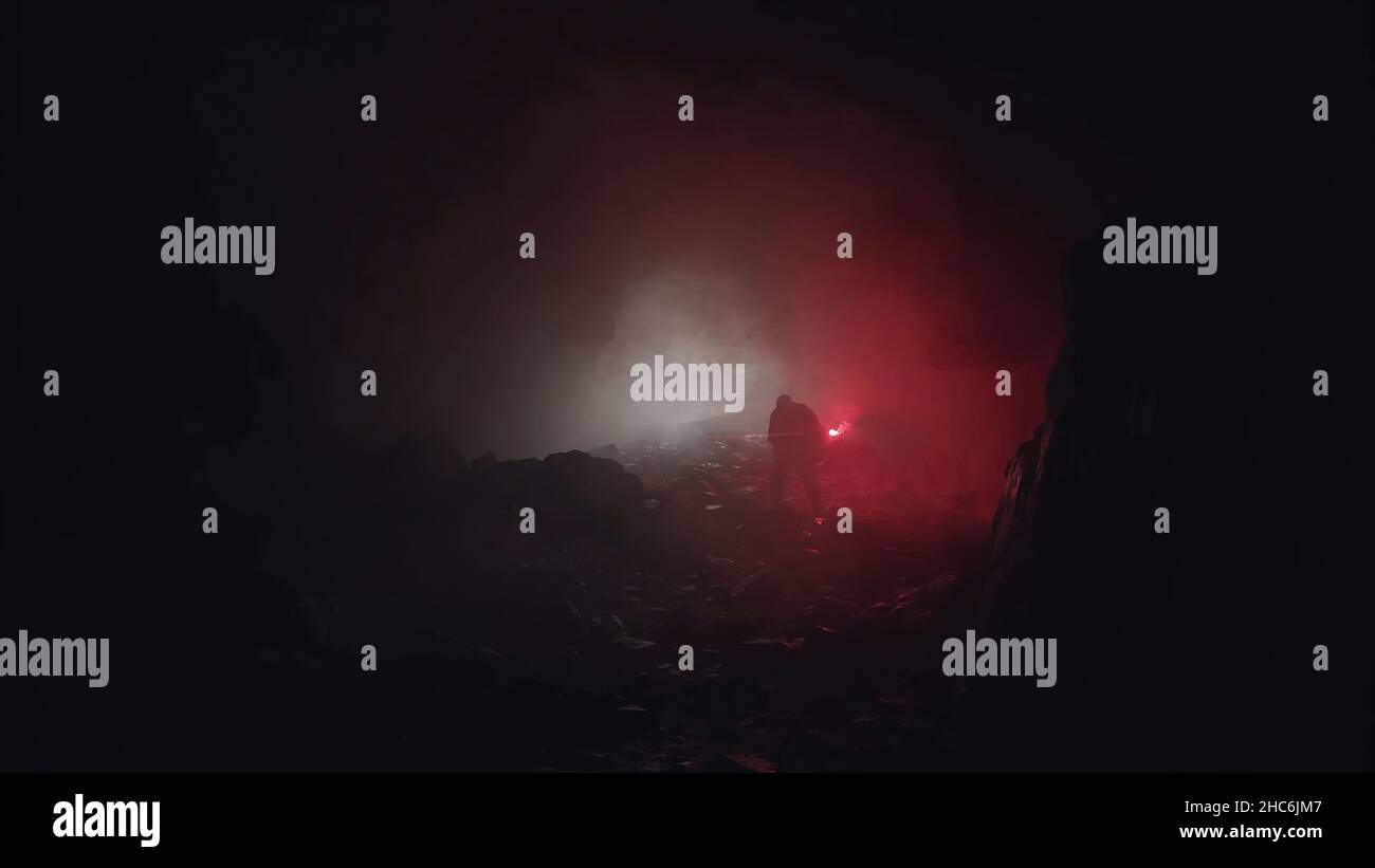 Silhouette of a geologist examining dark cave, holding red signal flare ...