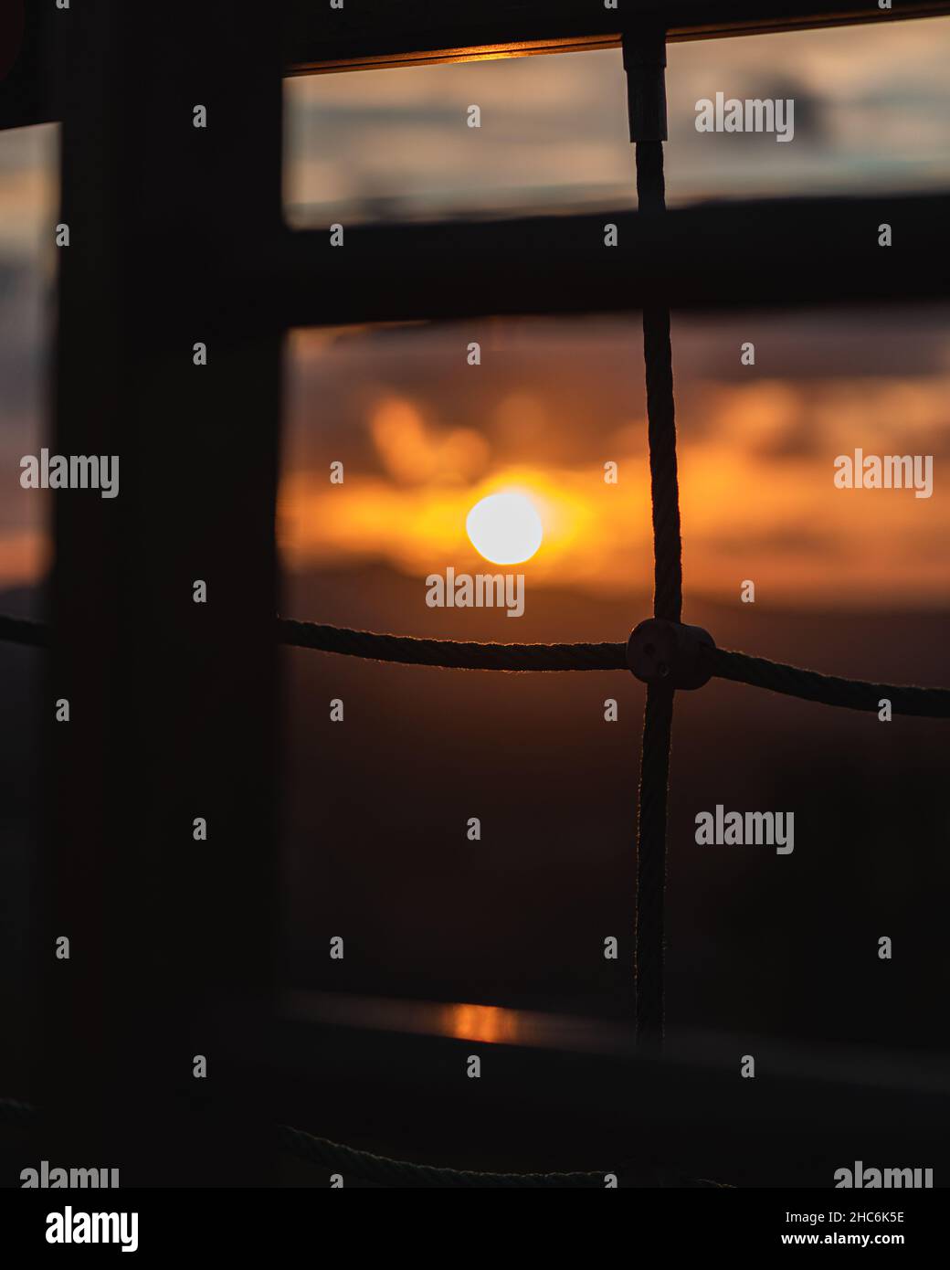 Vertical selective focus of a mesh of football goal on a colorful ...