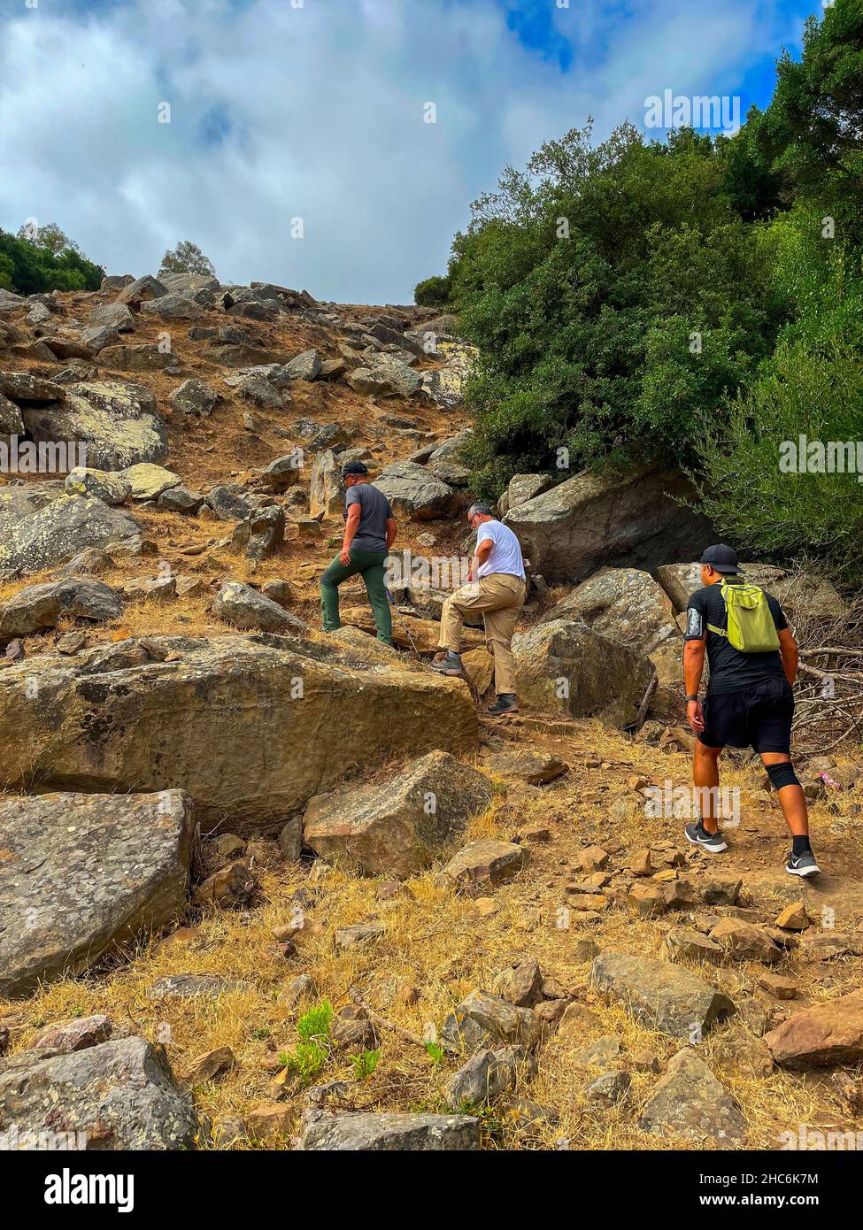 Three men climbing mountain hi-res stock photography and images - Alamy