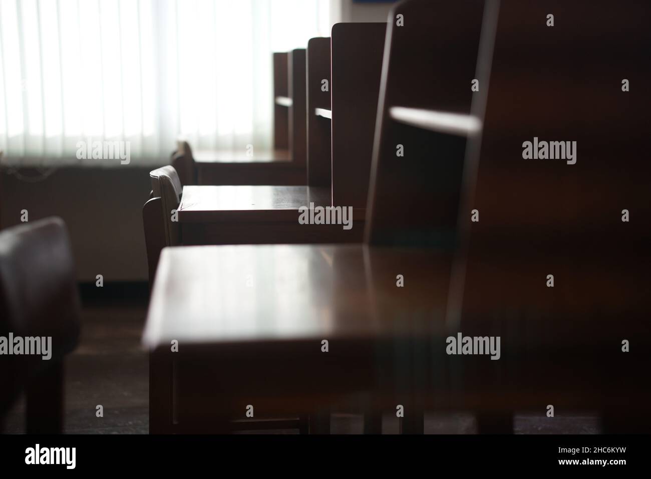 wooden table chair for reading in library interior Stock Photo - Alamy