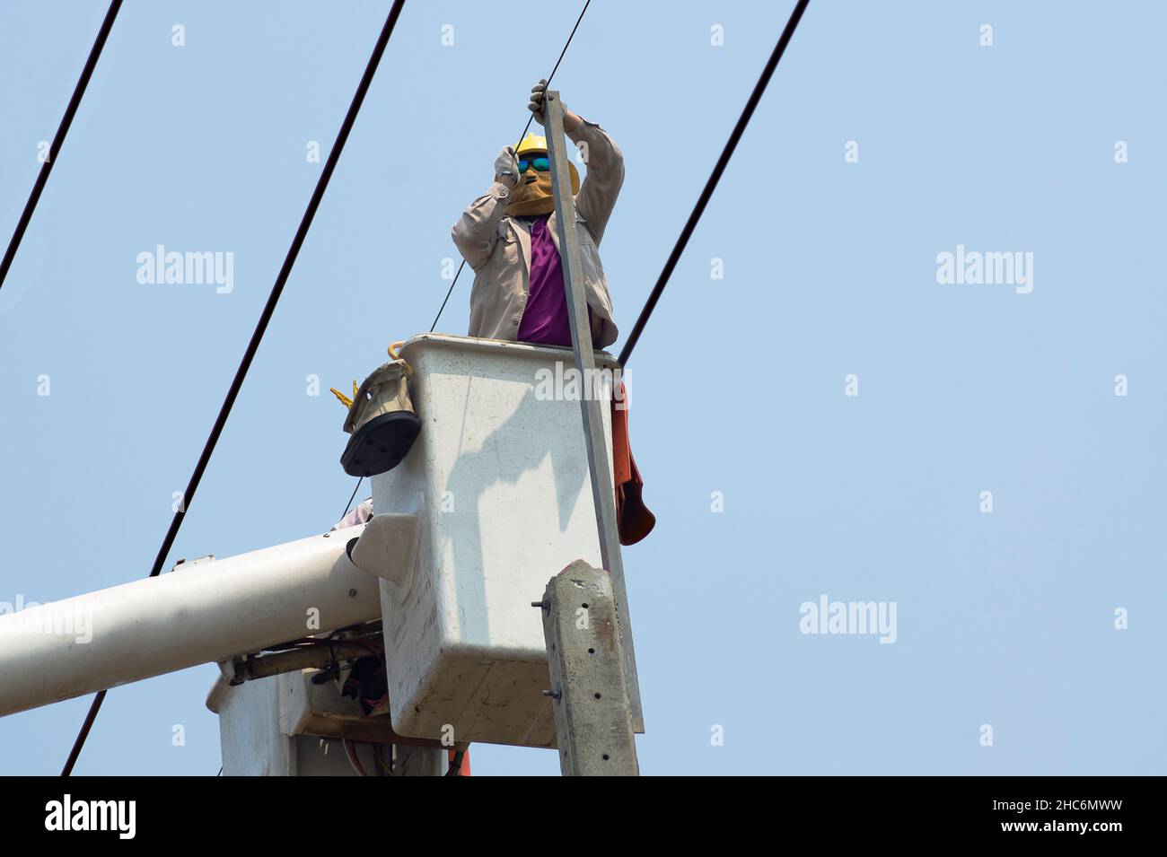 Worker climbing utility pole hi-res stock photography and images - Alamy