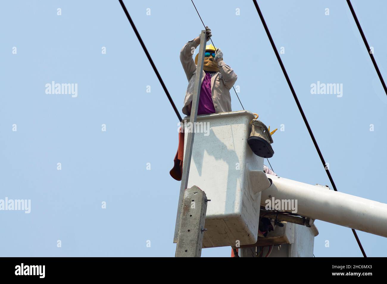Worker climbing utility pole hi-res stock photography and images - Alamy