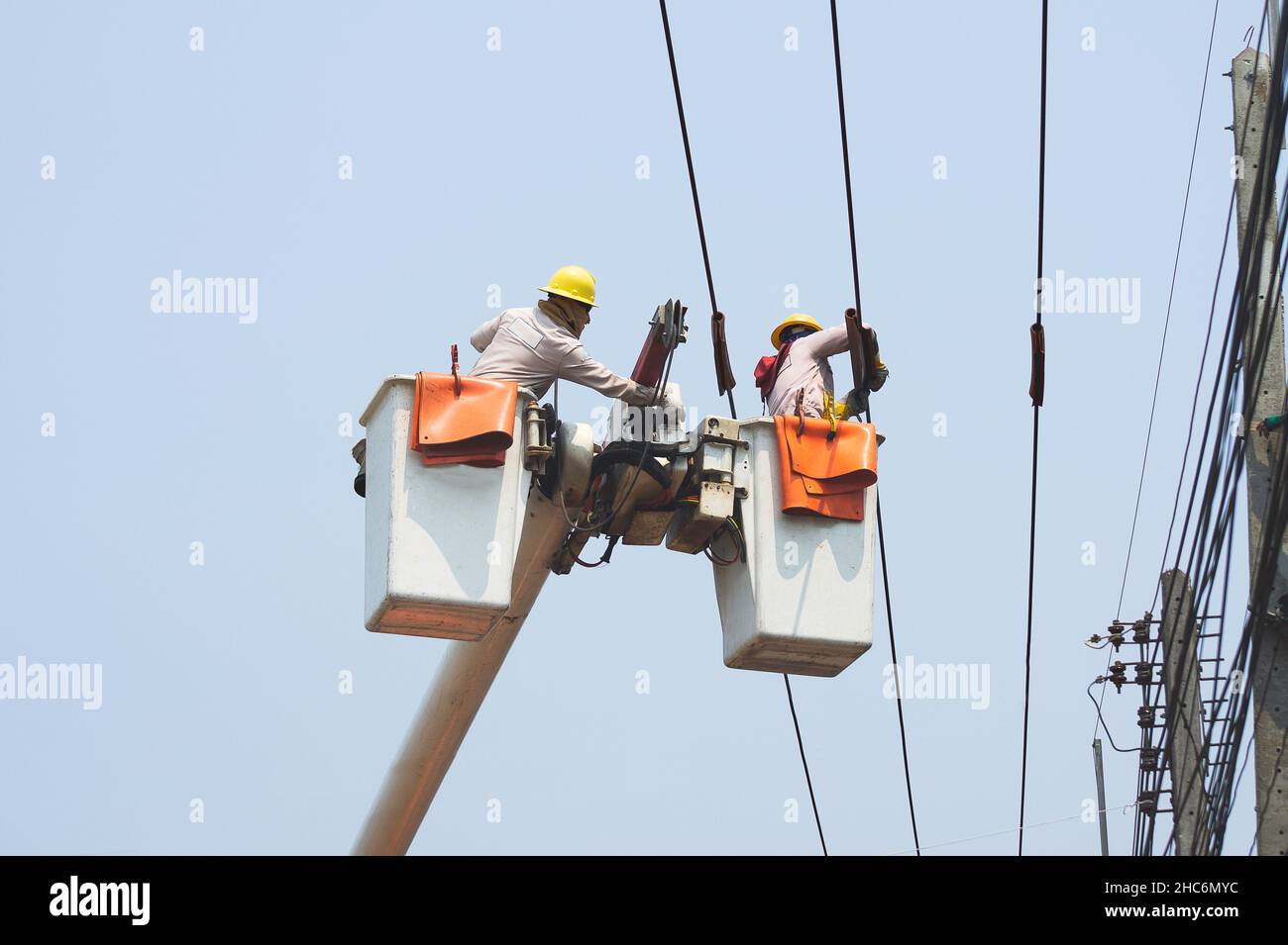 Worker climbing utility pole hi-res stock photography and images - Alamy