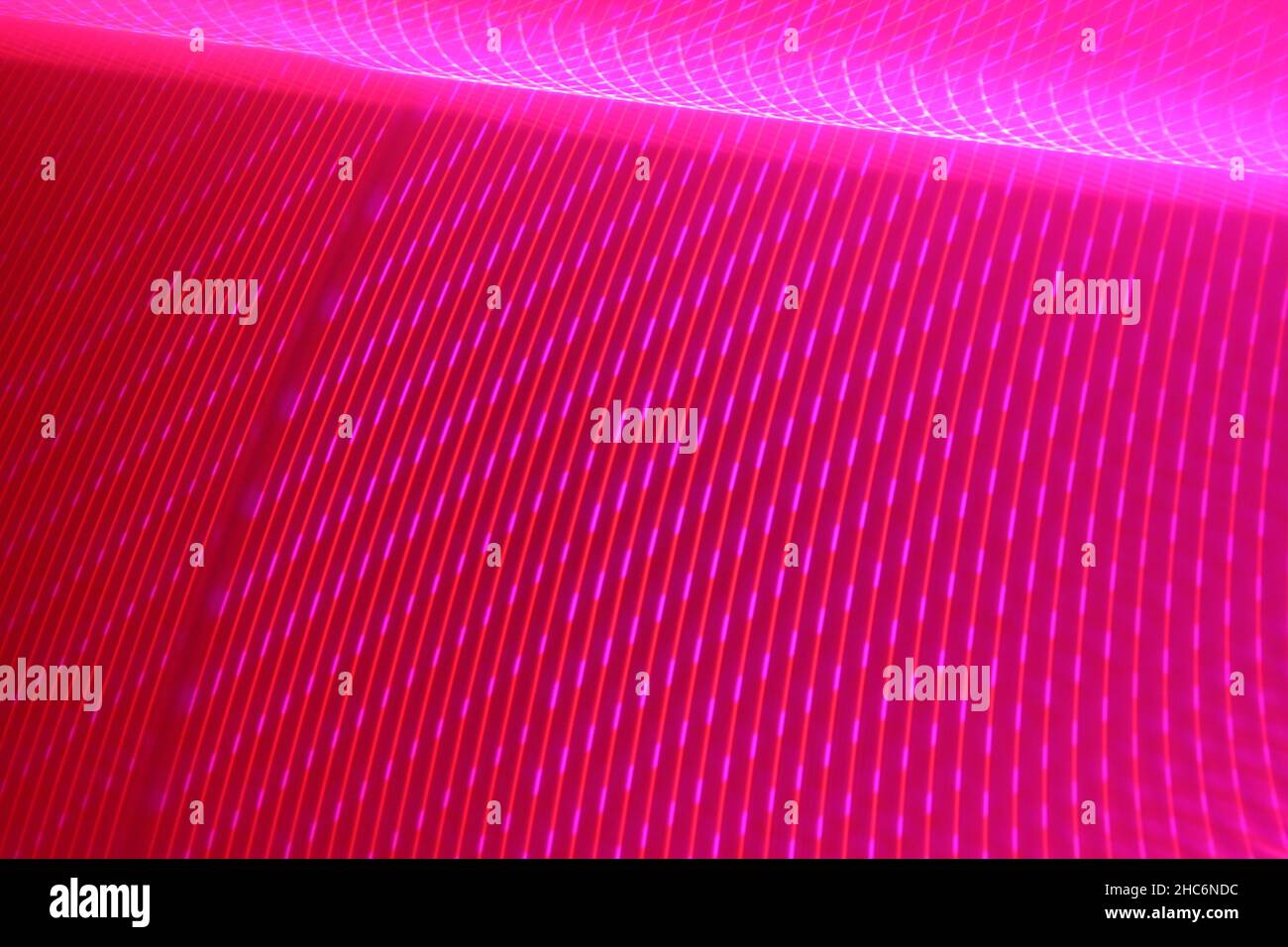 A pink digital tech background design with abstract illuminated lines ...
