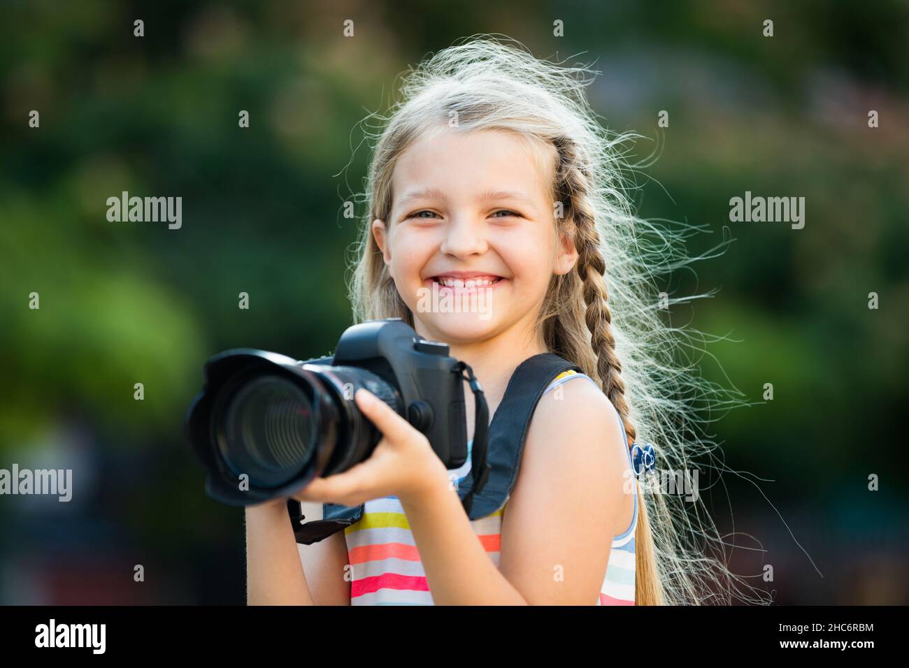 little girl with camera outdoors Stock Photo - Alamy