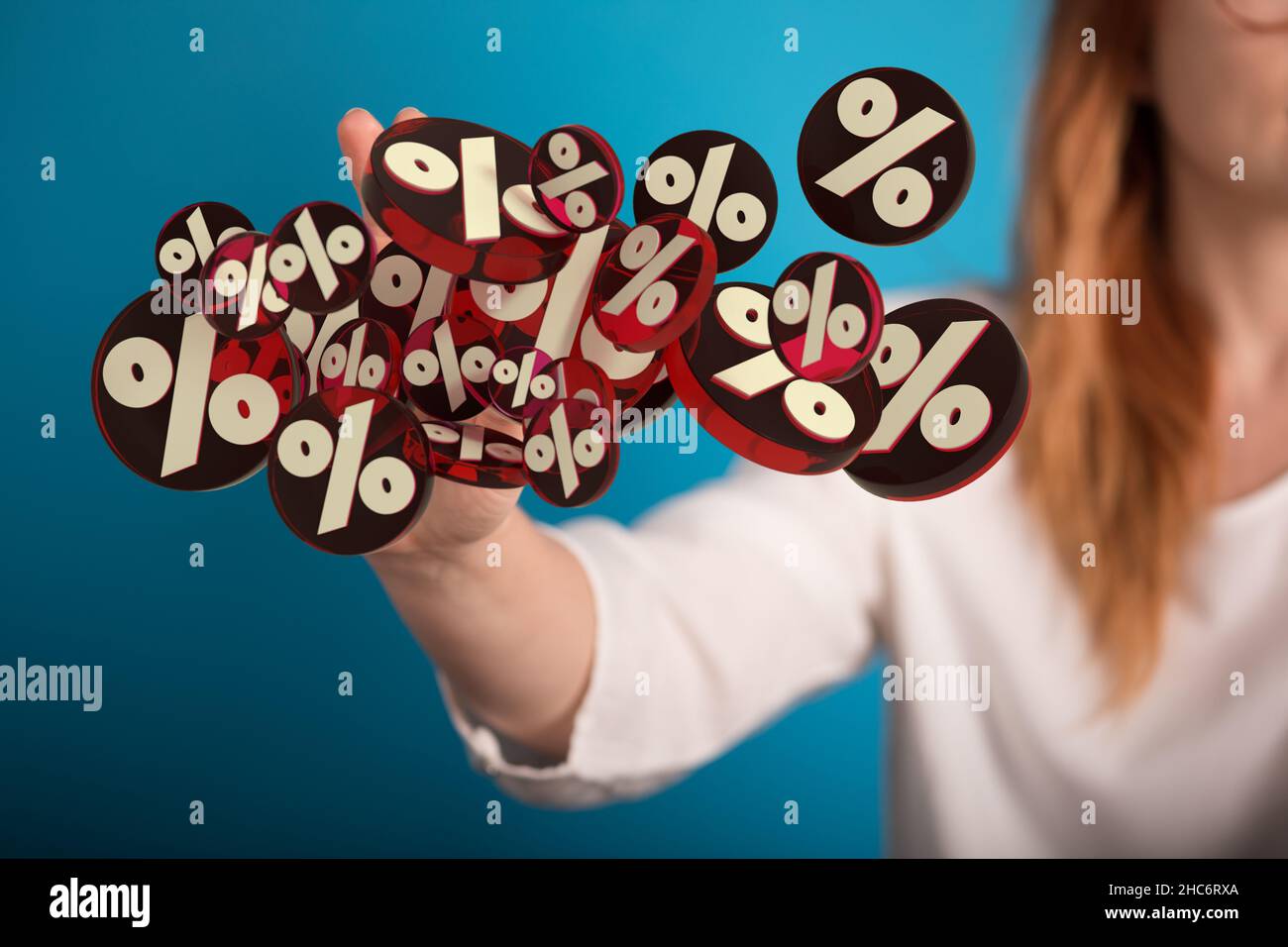 Male's hand holding an illustration of a bunch of red and white percent ...