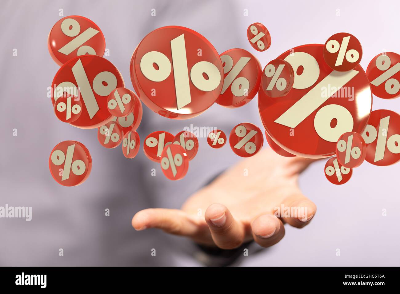 Male's hand holding an illustration of a bunch of red and white percent ...