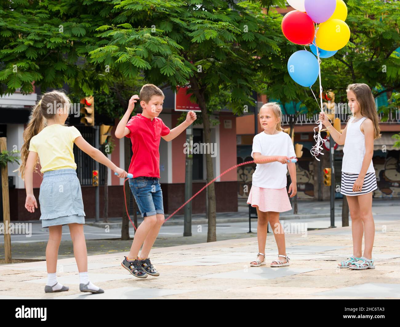Children jumping rope hi-res stock photography and images - Alamy