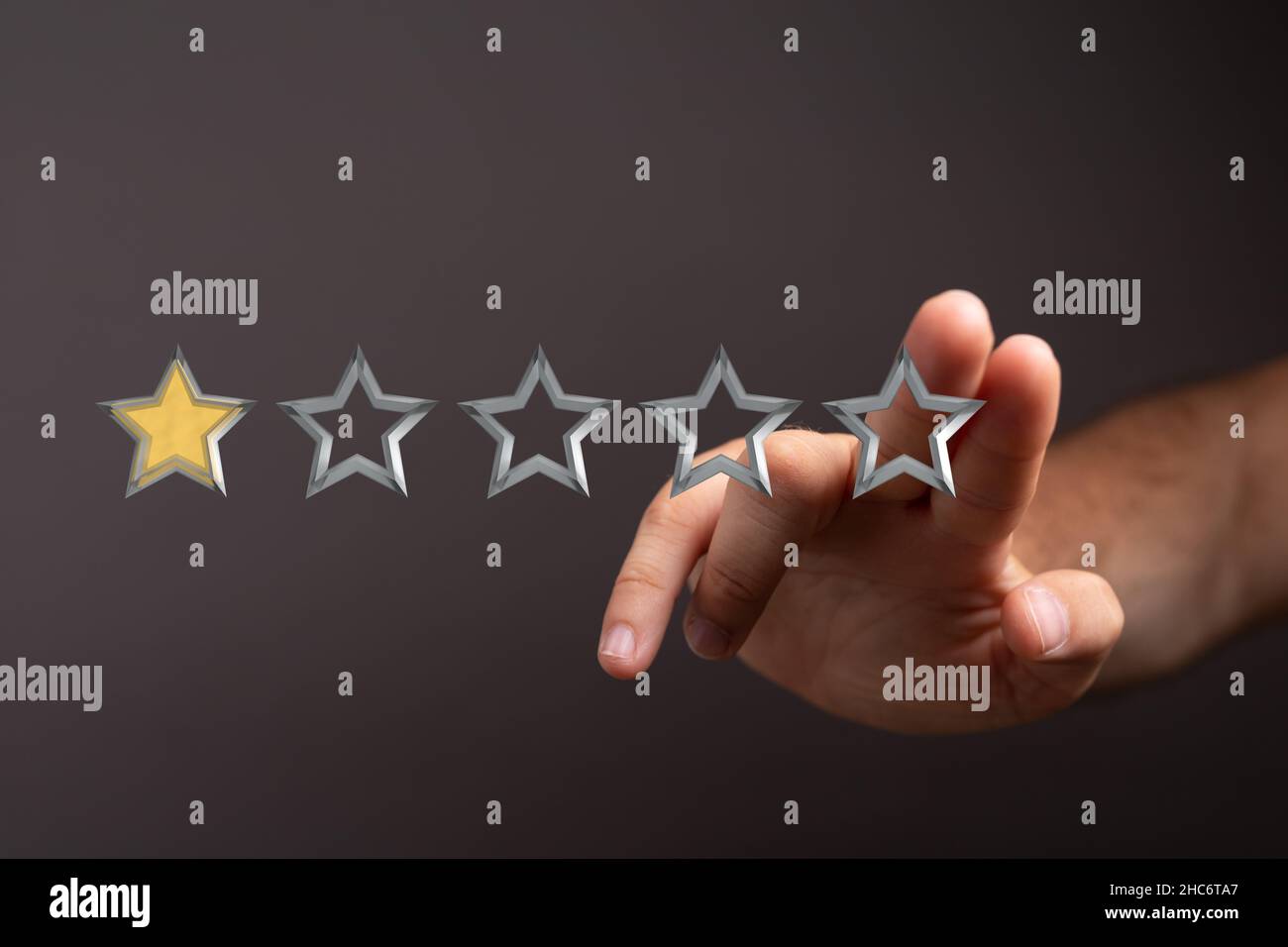 Male's hand pointing to illustrated rating stars Stock Photo - Alamy