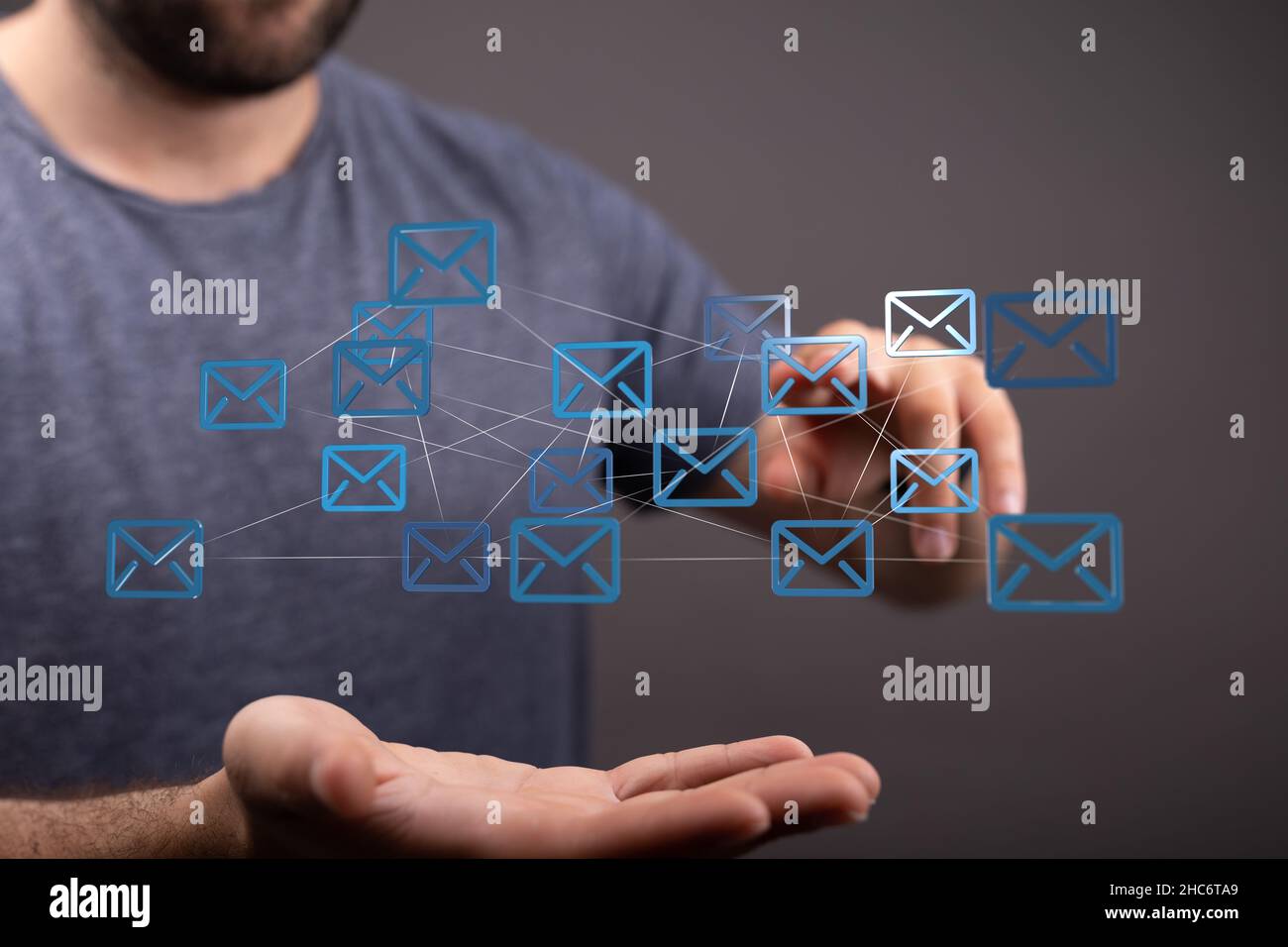 Male's hand pointing to a bunch of illustrated blue email signs Stock ...