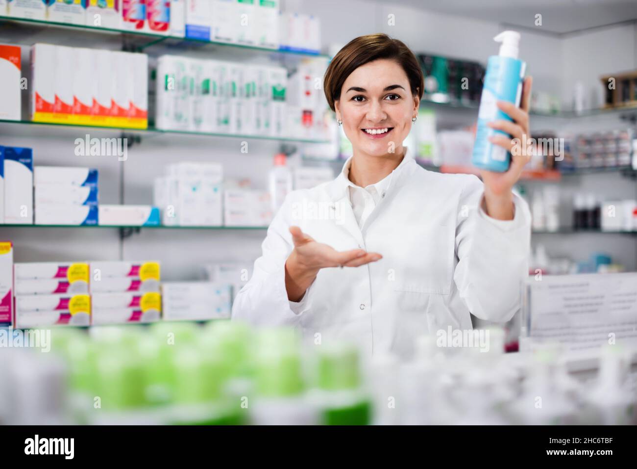 Female pharmacist suggesting useful body care products Stock Photo - Alamy
