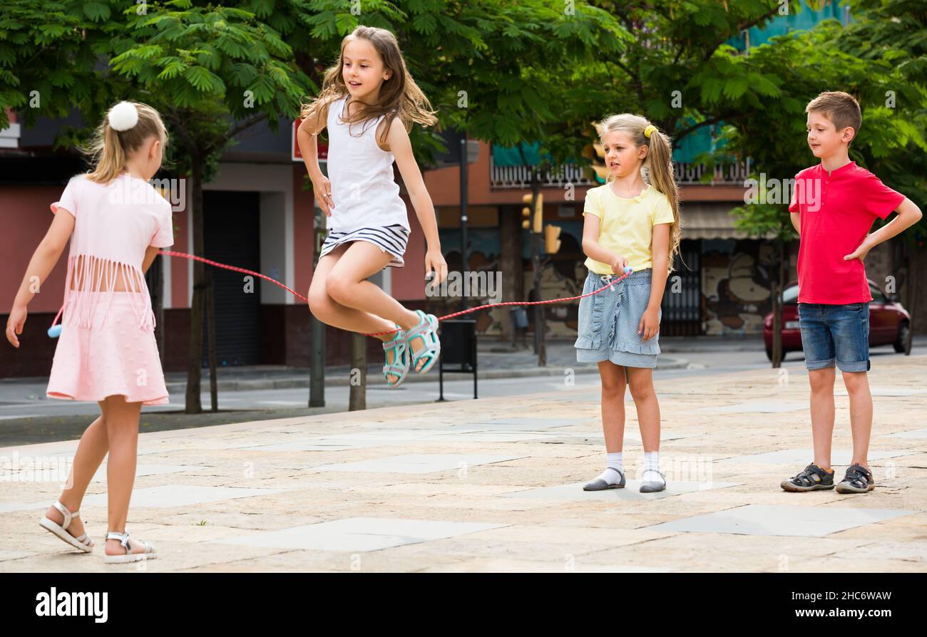 Children jumping rope hi-res stock photography and images - Alamy