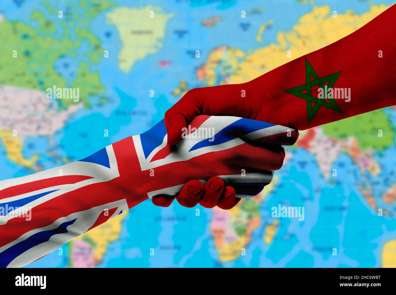 Handshake between United Kingdom and Morocco flags painted on hands ...