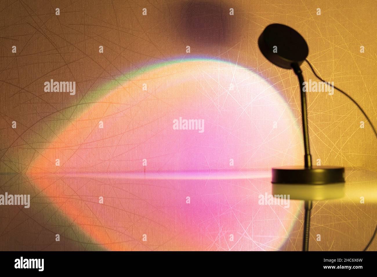 Sunset LED RGB lighting decor. Shadow on surface illuminated by ...