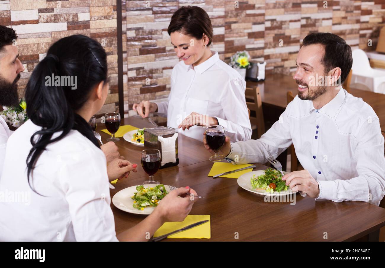 Group of people dining out in restaurant Stock Photo - Alamy
