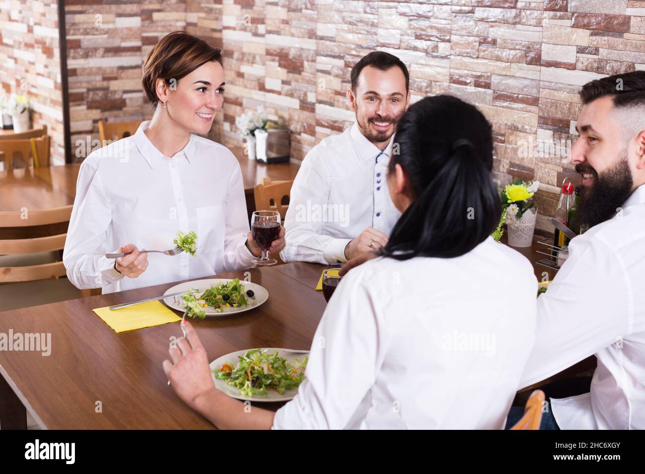Group of people dining out in restaurant Stock Photo - Alamy