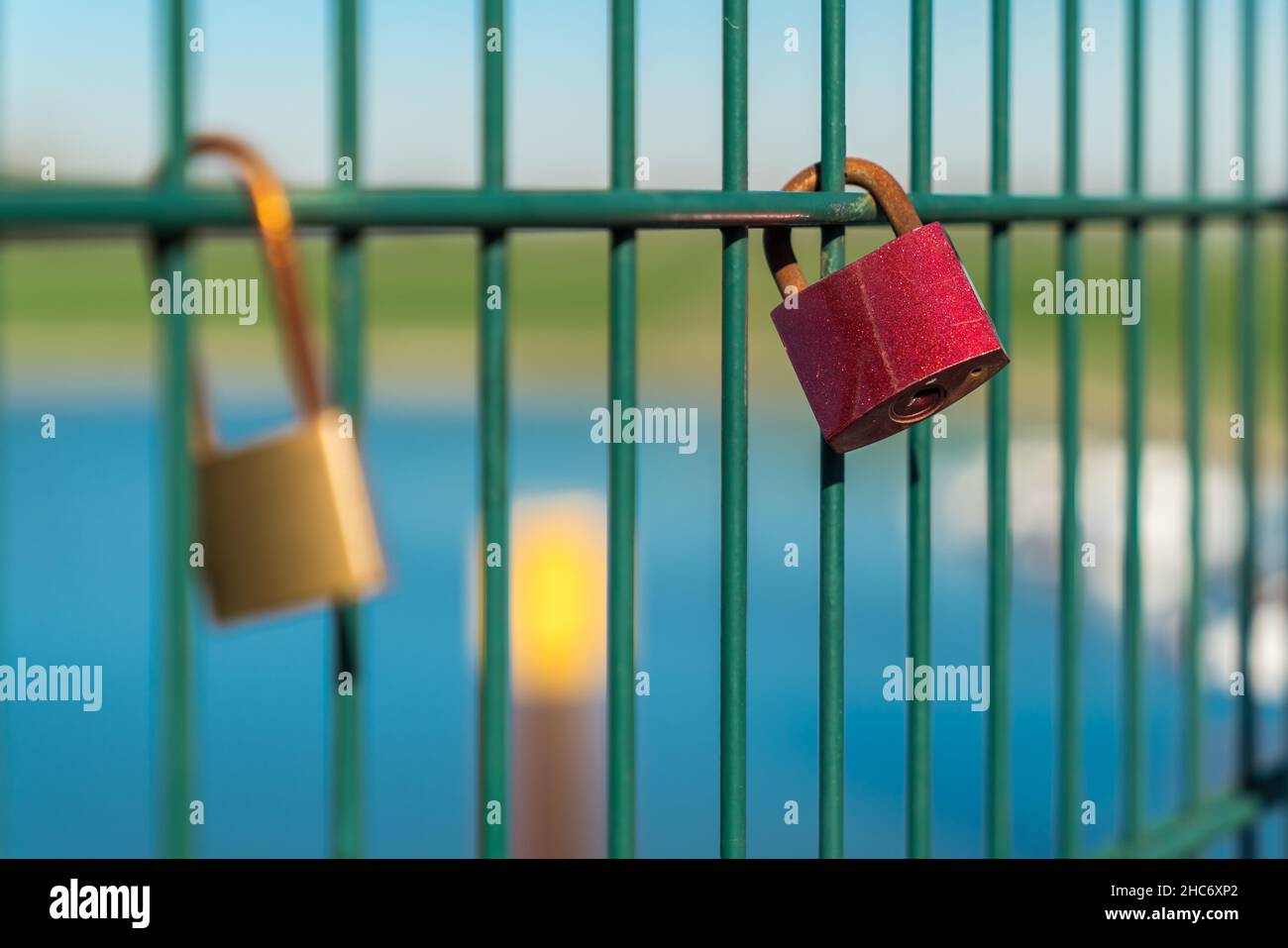 Love locks on a gate with blurry background Stock Photo - Alamy