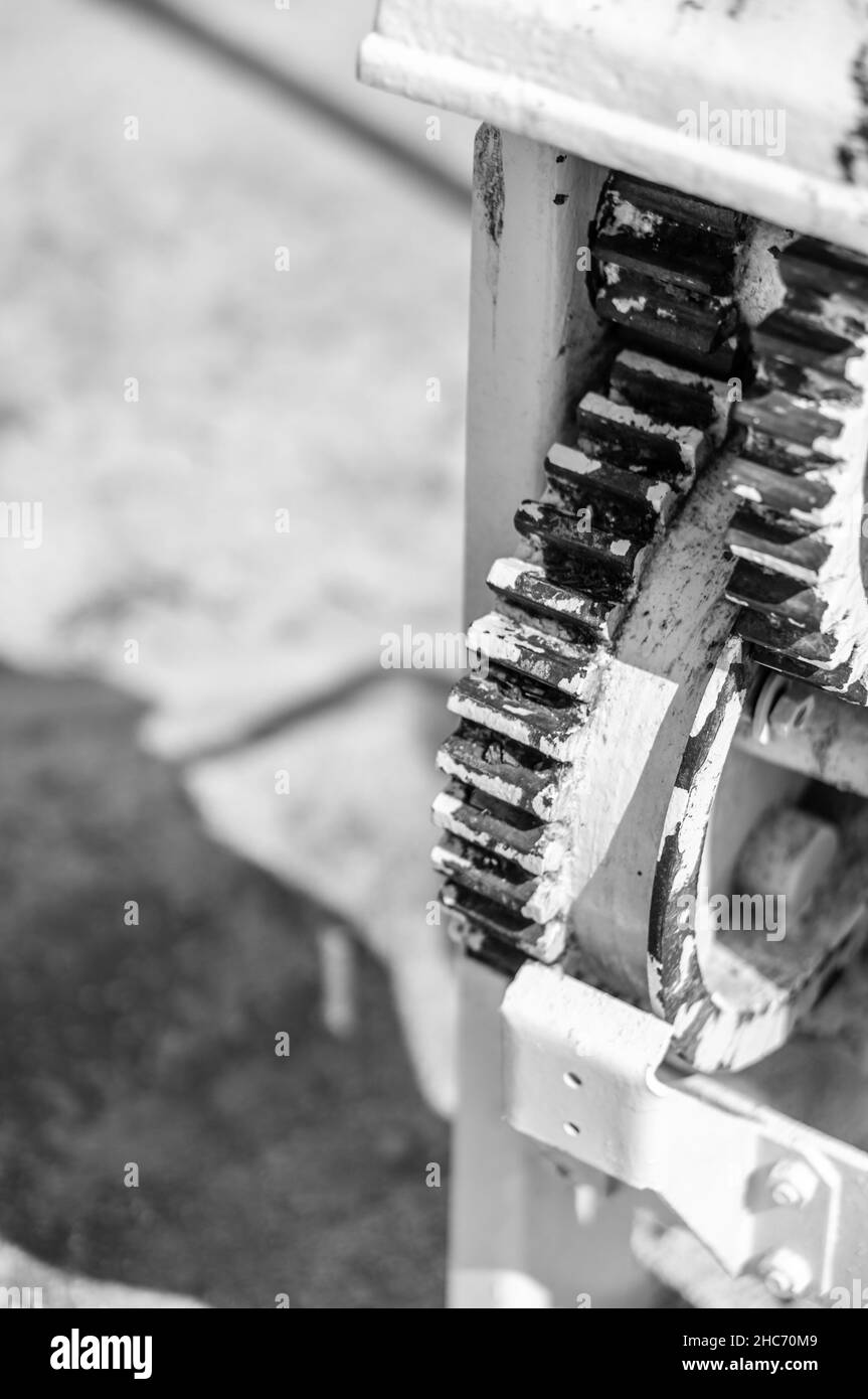 Vertical grayscale shot of rusty gears Stock Photo - Alamy