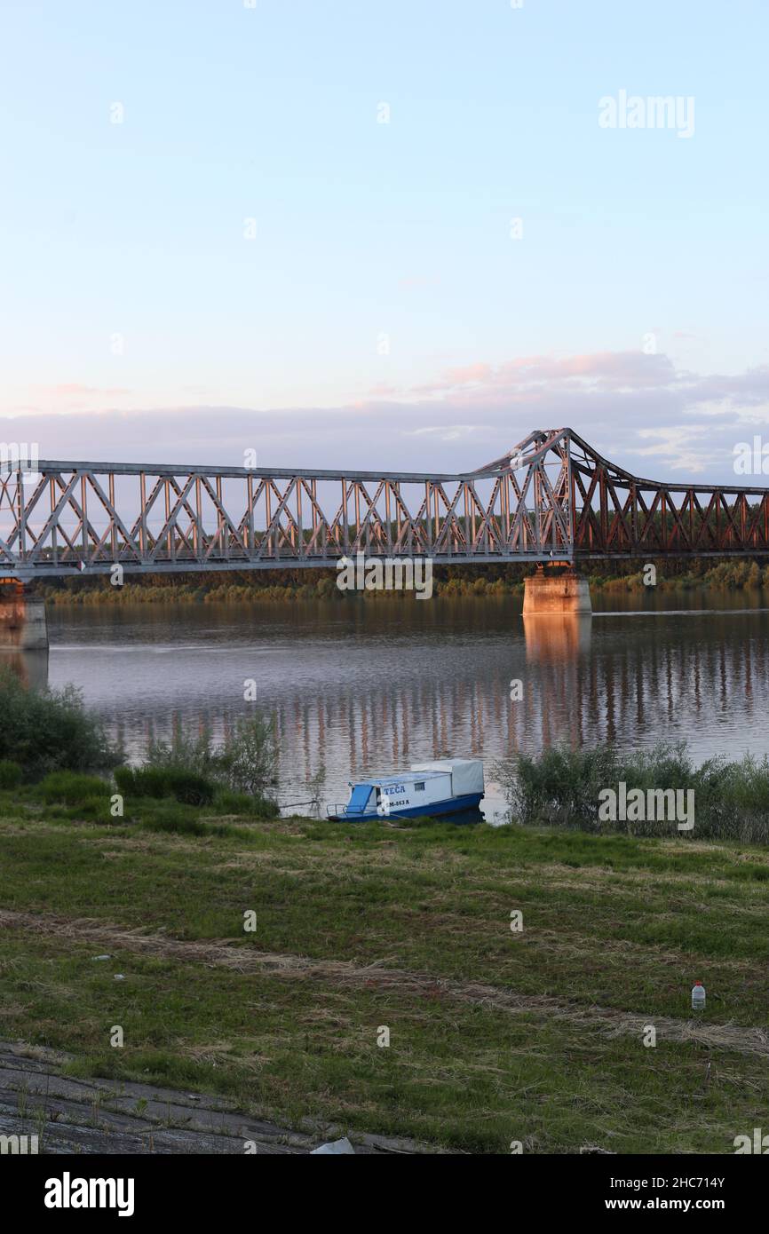 Vertical shot of the metal bridge over the river Stock Photo - Alamy