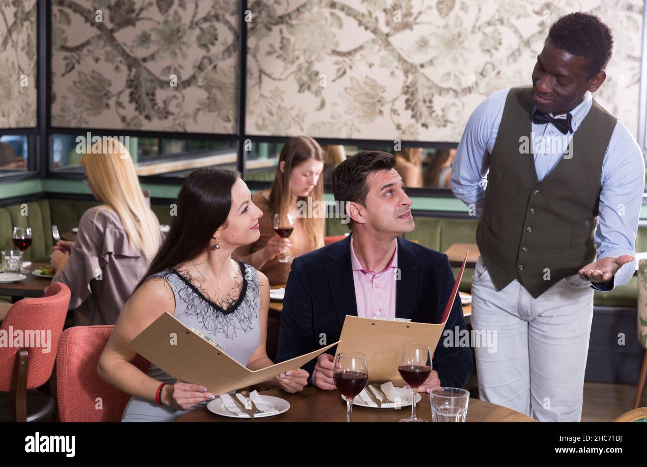 African american waiter red hi-res stock photography and images - Alamy