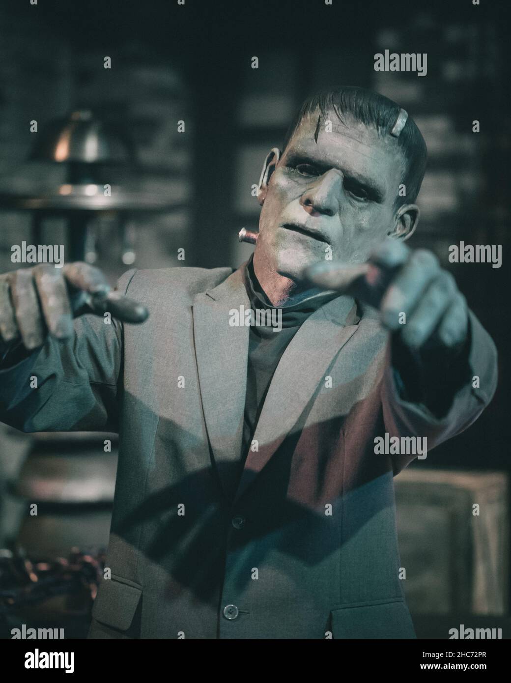 Vertical shot of a cosplayer dressed up as Frankenstein during the ...