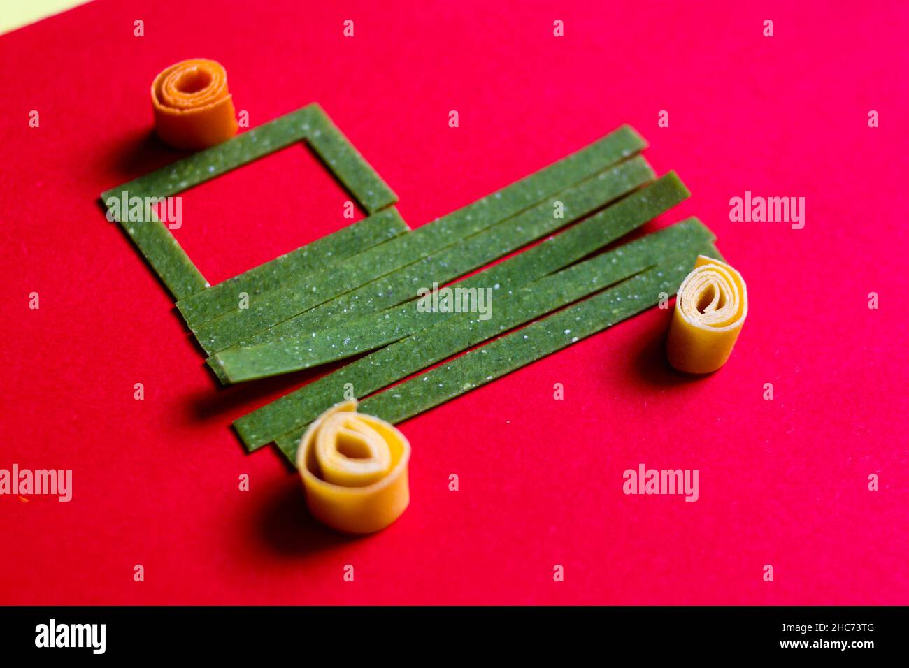 Car made of homemade pasta on a red cover Stock Photo - Alamy