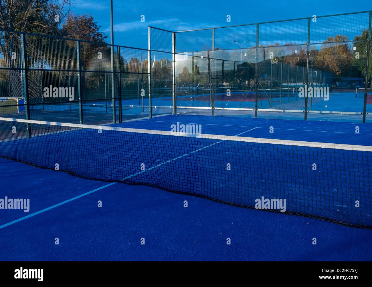 Partial view of a blue paddle tennis court Stock Photo - Alamy