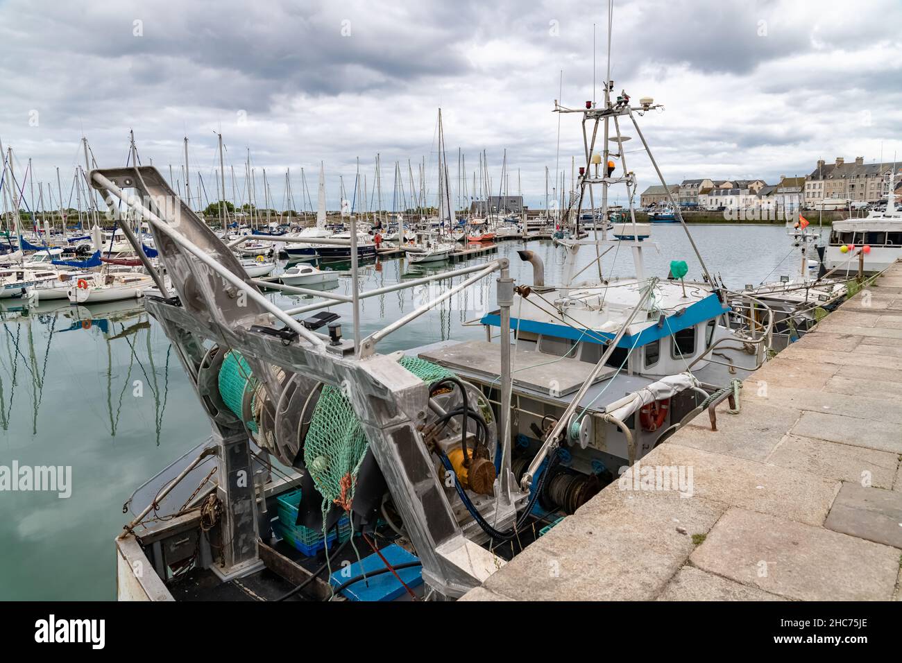 Barfleur in Normandy, the harbor, with traditional houses in background ...