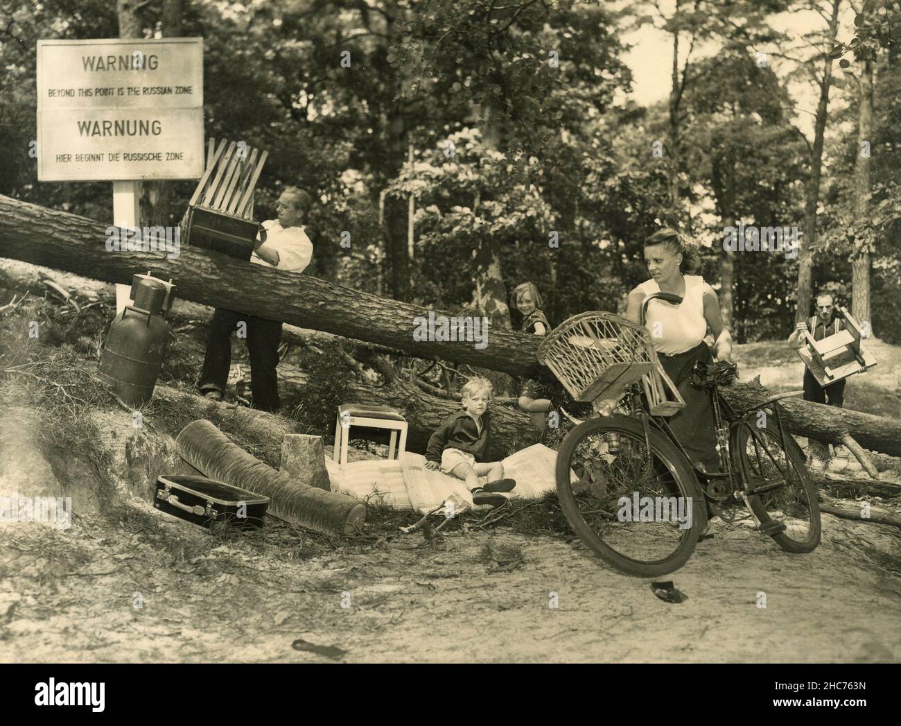 Family fleeing from East Germany in the forest, Germany 1950s Stock ...