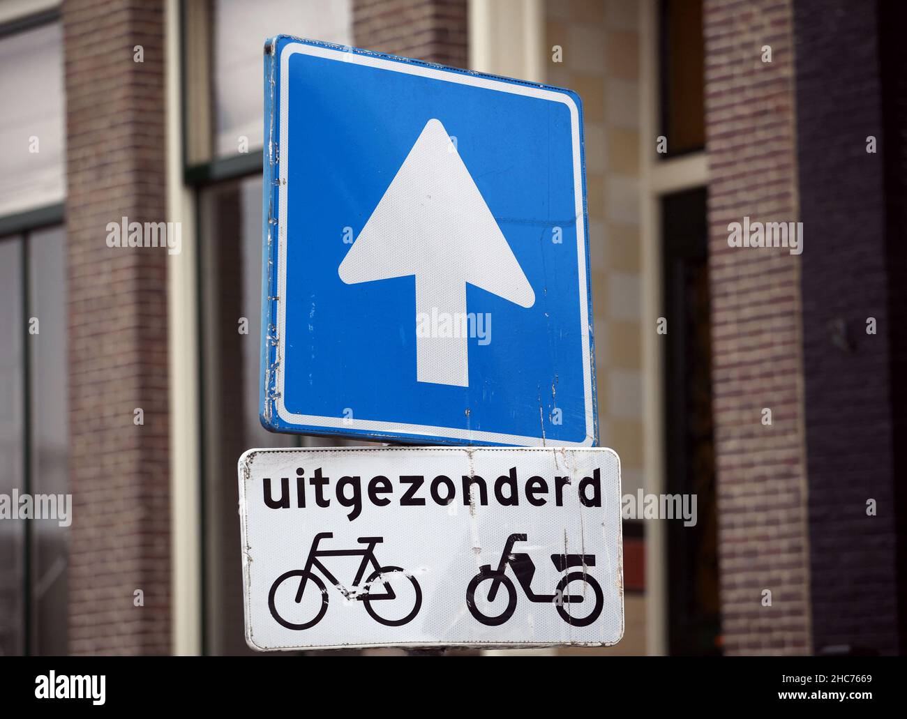A blue arrow and bicycle signs in Amsterdam Stock Photo - Alamy