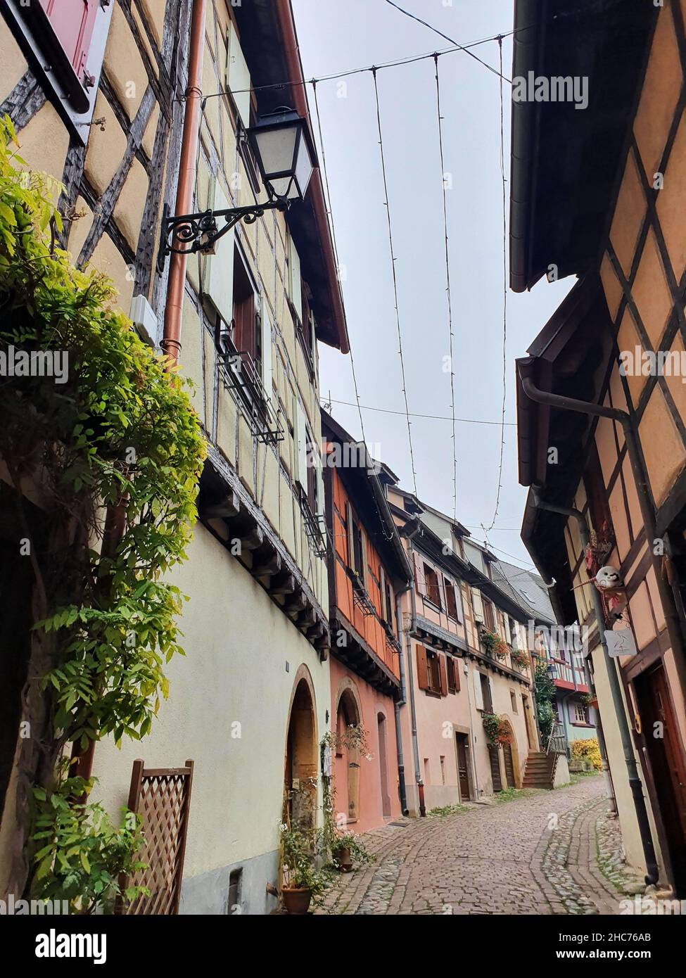 Old, narrow alley in Eguisheim town, Alsace, France Stock Photo - Alamy