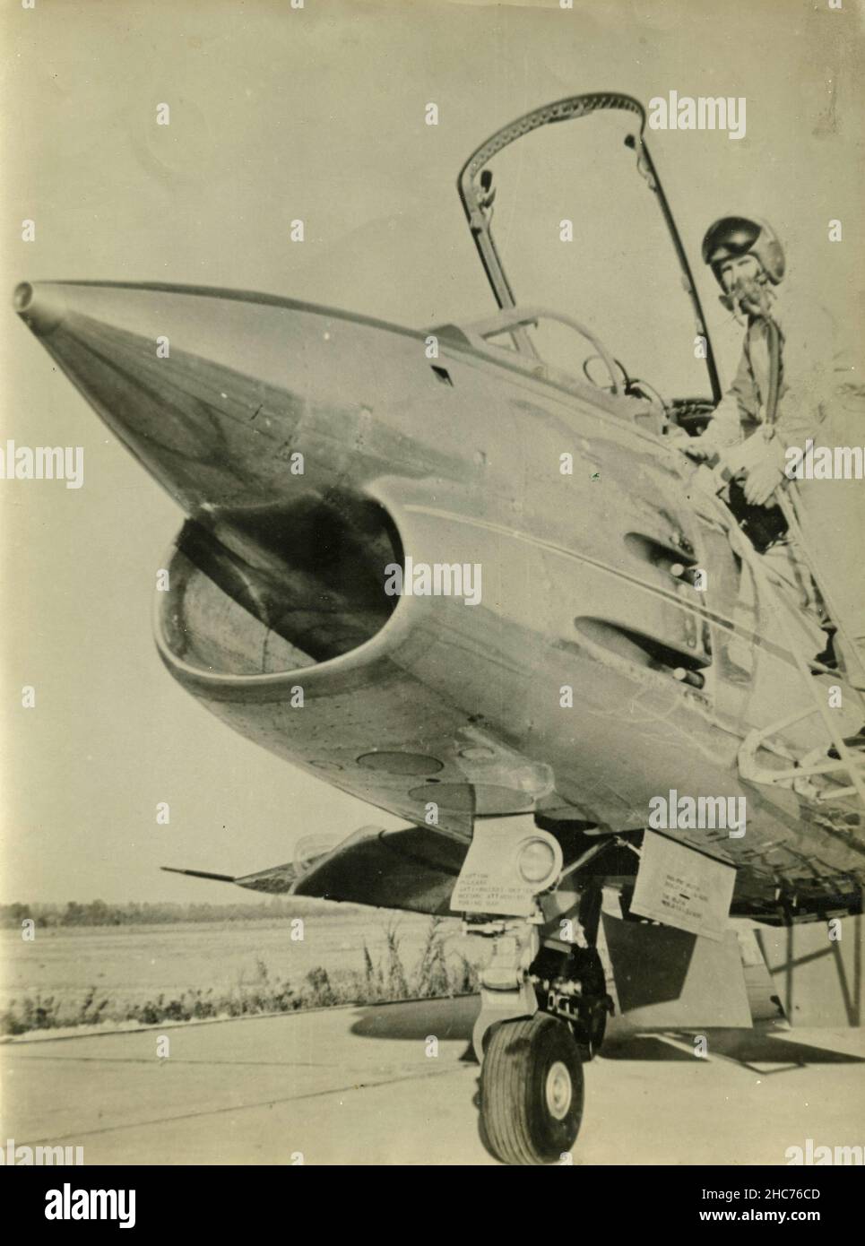 Pilot getting onboard a fighter plane, Italy 1970s Stock Photo - Alamy