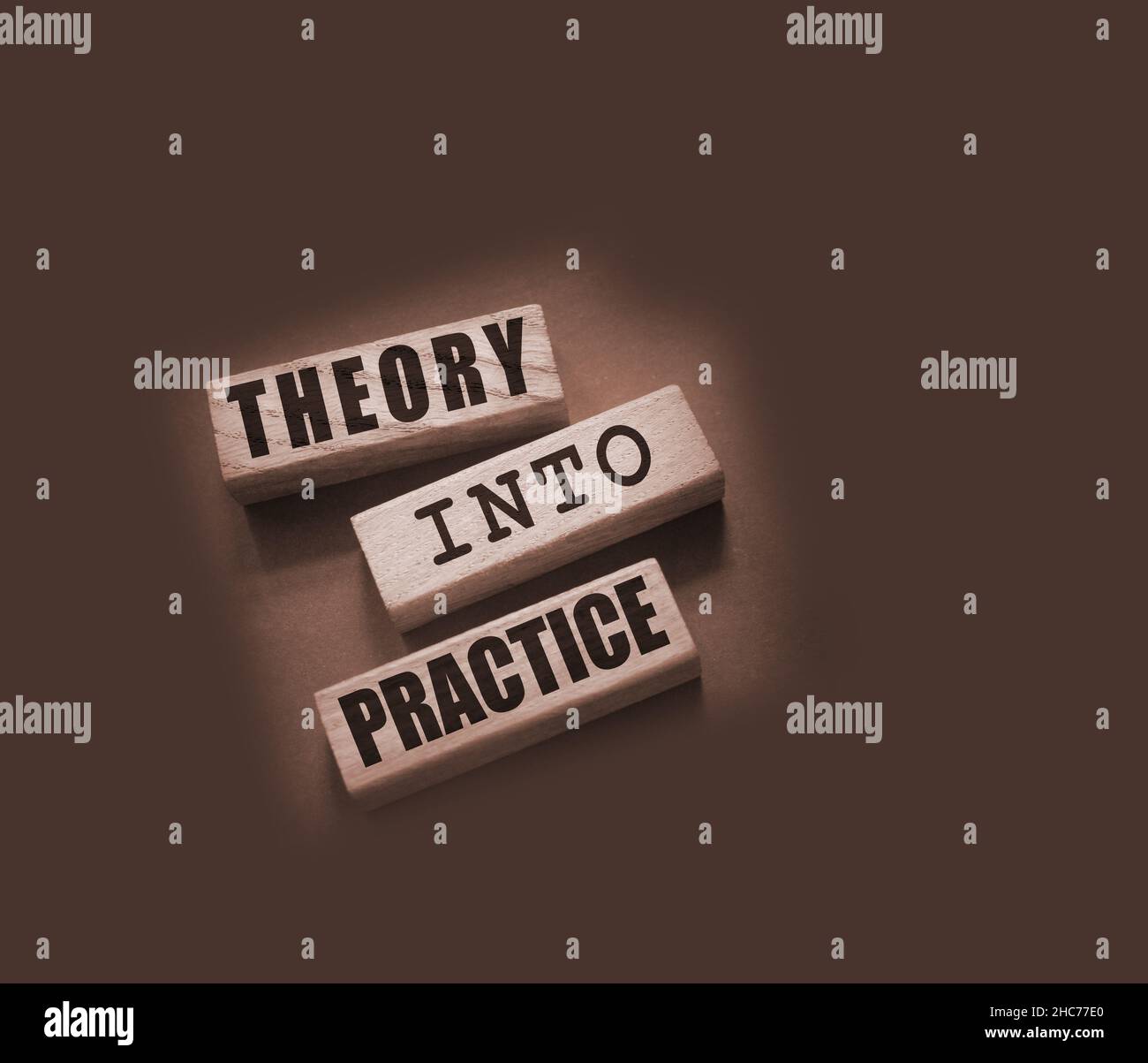 Theory into practice words written on wooden blocks. Education or ...